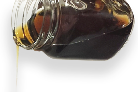 pouring-maple-syrup-out-of-jar - Maple Syrup Labels